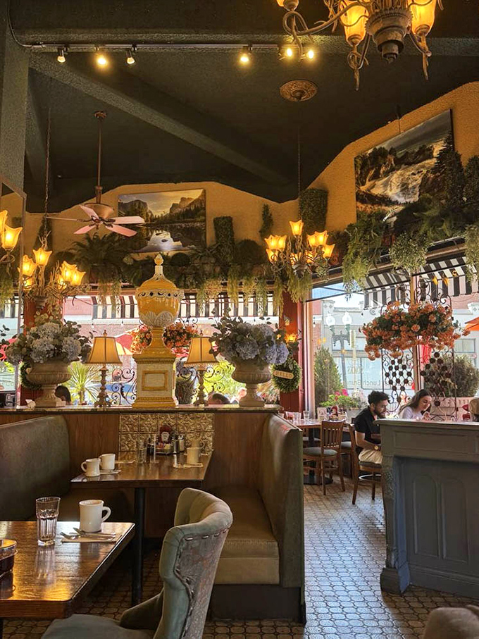 The interior feels like breakfast royalty &ndash; lush plants, dramatic lighting, and California landscape paintings creating an unexpected elegance for your morning meal.