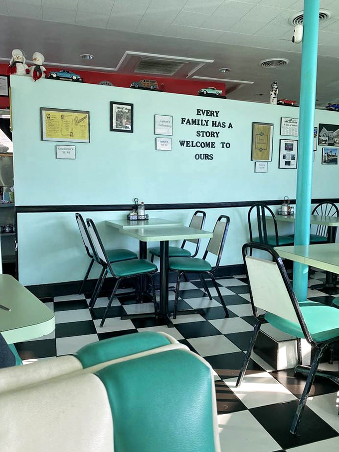 The quintessential 50's diner experience awaits with mint-green chairs, checkered floors, and a wall that literally tells you "Every family has a story" – yours is about to include excellent breakfast.