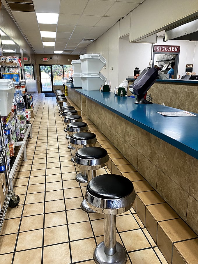The view down the counter shows democracy in action &ndash; everyone waits equally for their moment of sandwich glory.
