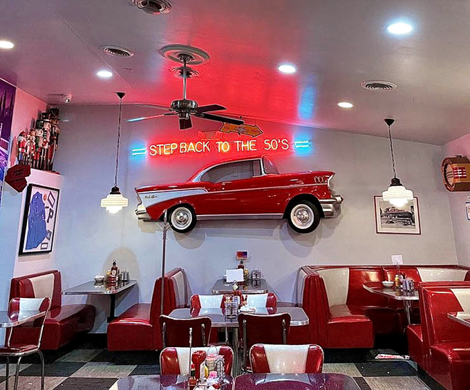 The "Step Back to the 50's" sign isn't kidding &ndash; that classic Chevy on the wall has witnessed countless happy diners.