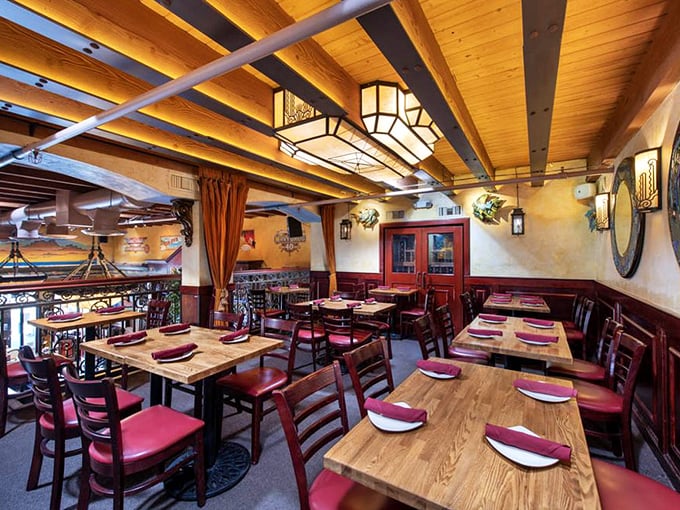 The upstairs dining area feels like the captain's quarters of a very stylish ship &ndash; warm woods, burgundy accents, and lighting that flatters everyone.