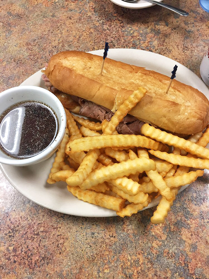 The French dip sandwich&mdash;where tender roast beef meets its soulmate in a pool of savory au jus, with crispy fries standing by for moral support.