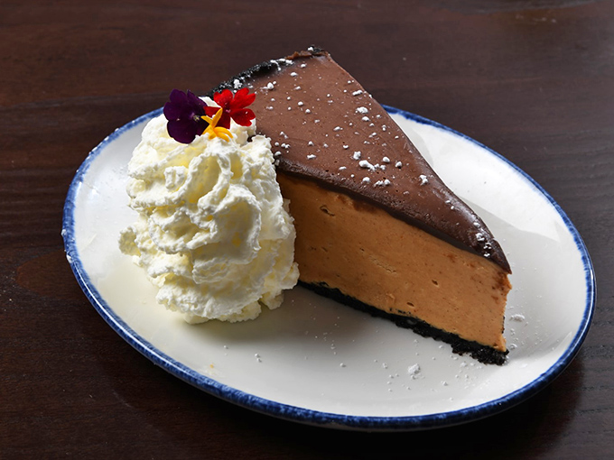 A slice of double chocolate cheesecake so decadent it should come with its own warning label and perhaps a tiny defibrillator. 