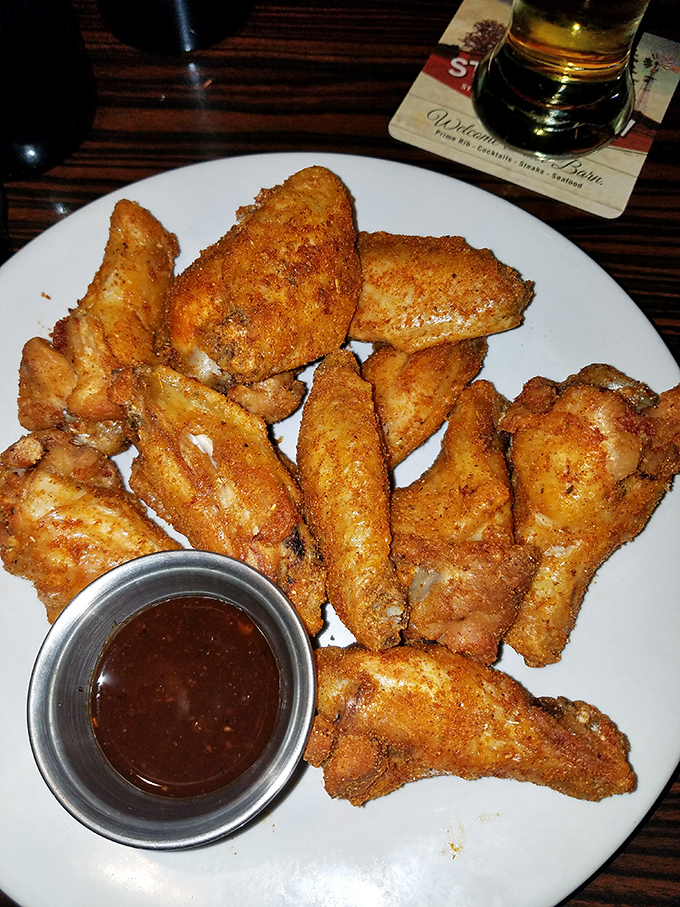 These crispy, dry-rubbed wings with their deep amber color aren't just appetizers &ndash; they're the opening act that deserves a standing ovation.