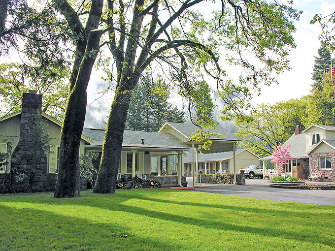 Dunsmuir Lodge embodies that perfect mountain retreat vibe, where massive trees and wraparound porches make "doing nothing" feel like an accomplishment.