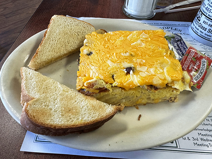 Breakfast casserole with melted cheese that would make even the most dedicated dieter temporarily reconsider their life choices. Worth every calorie.