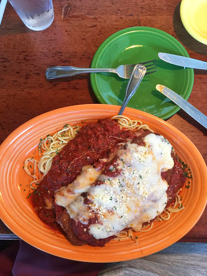 Chicken parmesan that's dressed for success &ndash; tender cutlet, vibrant sauce, and cheese melted to perfection over al dente pasta.