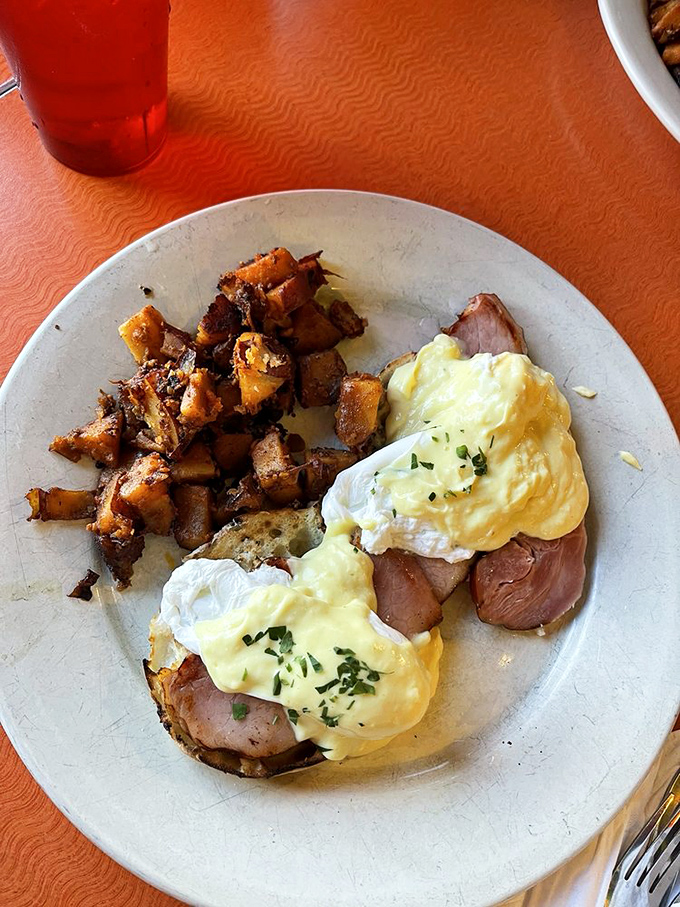 Eggs Benedict with home fries &ndash; the breakfast equivalent of wearing a tuxedo T-shirt. Fancy enough to impress, comfortable enough to devour.