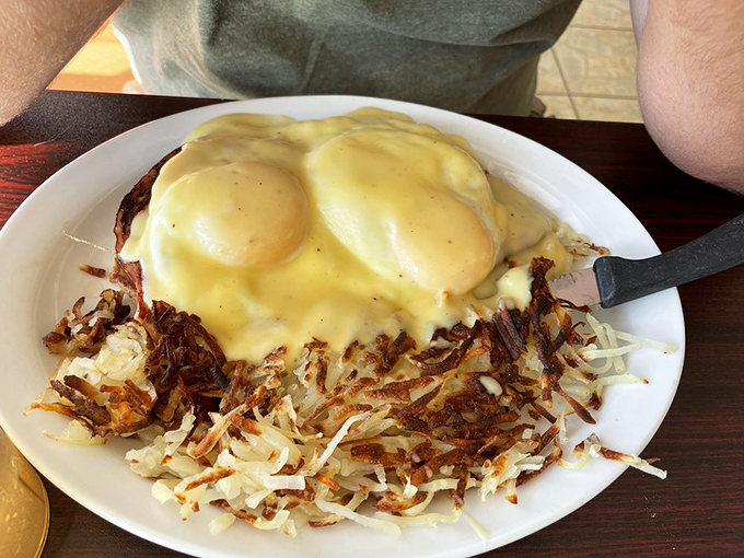 Eggs Benedict with a side of hash browns &ndash; the breakfast equivalent of wearing a tuxedo to the beach. Fancy yet perfectly at home.