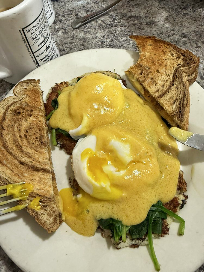 Eggs Benedict: where hollandaise sauce flows like liquid gold over perfectly poached eggs that surrender at the touch of a fork.