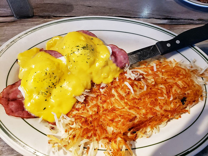 Eggs Benedict with hash browns so perfectly crispy, they make the morning news worth facing. Hollandaise diplomacy at its finest.