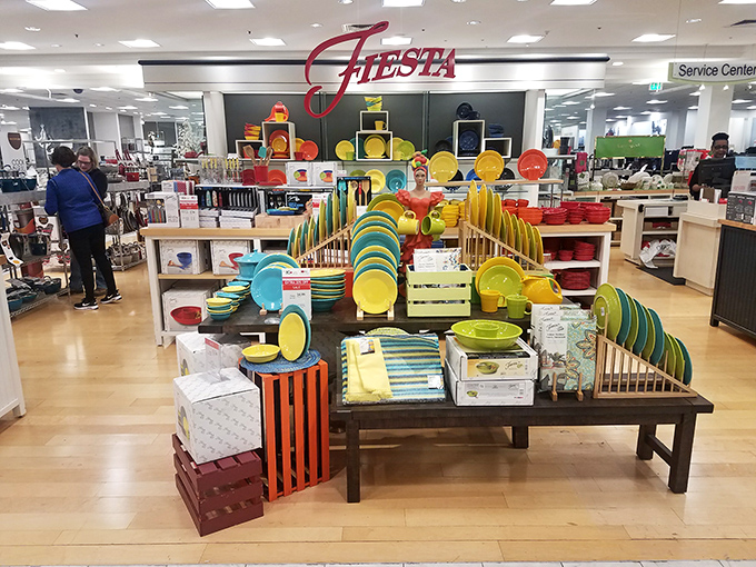 Fiesta dinnerware display that makes you suddenly realize your kitchen is desperately lacking in turquoise plates and sunshine-yellow serving bowls.