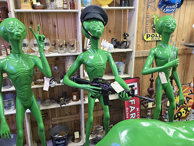 The alien welcoming committee stands ready with peace signs and... automatic weapons? The '90s were a confusing time for extraterrestrials.