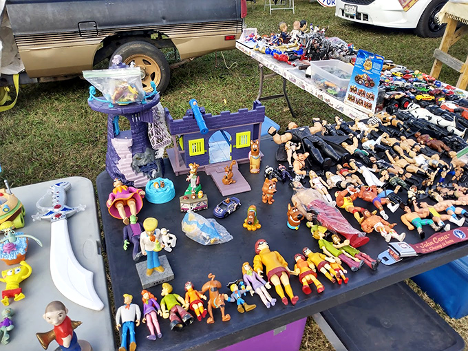 An army of action figures stands at attention, ready to march from this flea market table straight into nostalgic collectors' hearts.