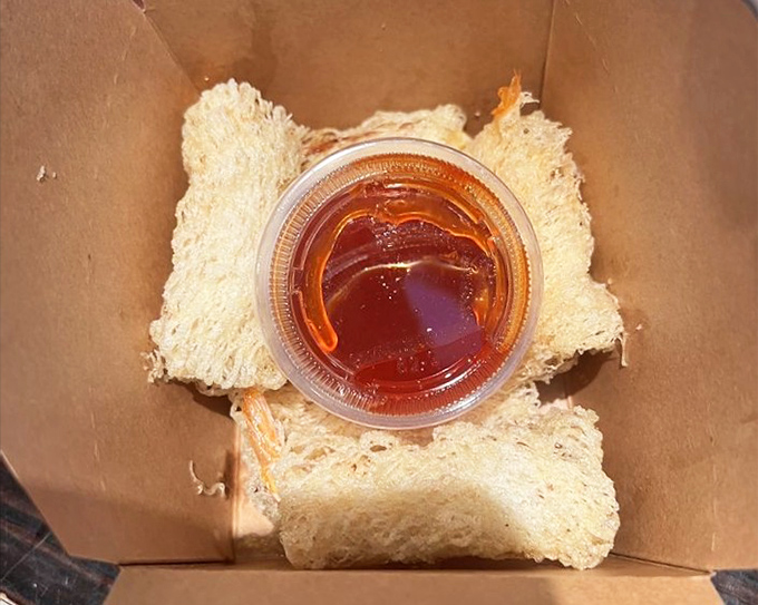 The firecracker shrimp arrives like tiny gifts in a cardboard box&mdash;unwrap with caution, your taste buds might explode.