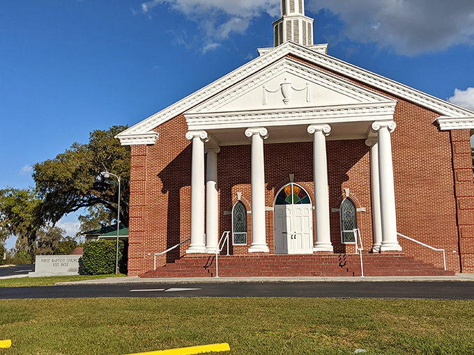 First Baptist Church's stately columns and brick facade represent the architectural grace that makes Brooksville's historic buildings so photogenic.