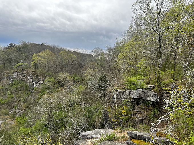 Storm clouds gather over the rolling hills, creating a dramatic backdrop that would make any landscape painter reach frantically for their brushes.