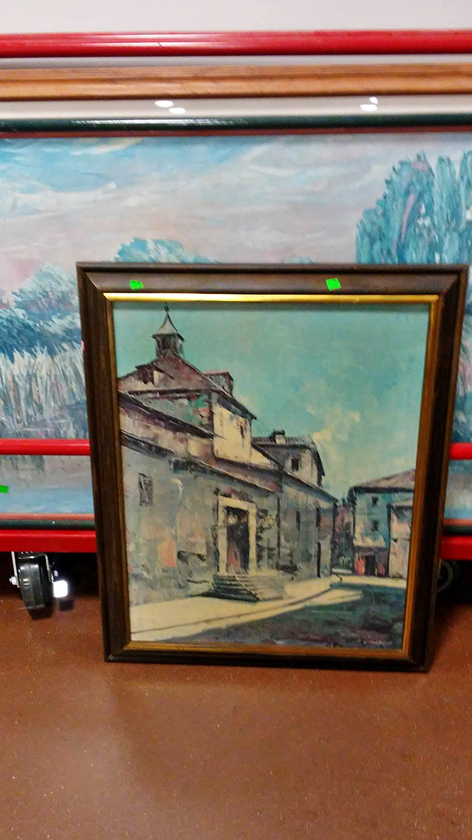 Art waiting for its second act. That European village scene could be the conversation piece your dining room wall has been missing.