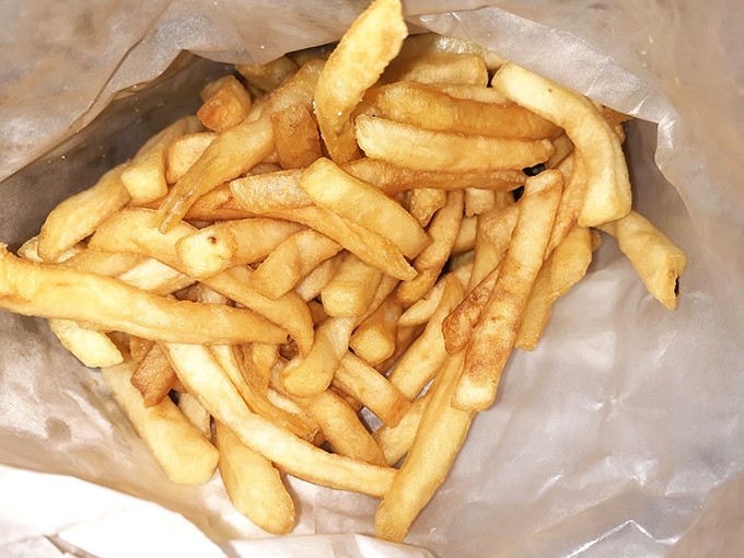 French fries that understand their supporting role&mdash;crispy, golden, and ready to mop up whatever sauce you couldn't bear to leave behind.