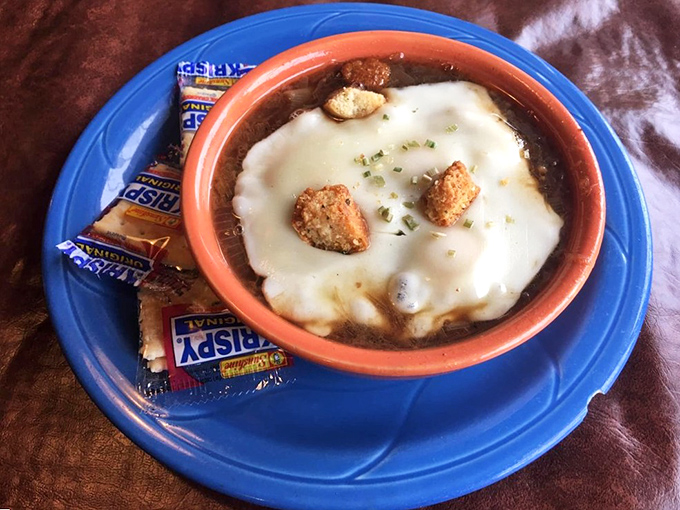 French onion soup that's wearing a melted cheese beret. It's the kind of comfort food that makes you want to hug the bowl before devouring its contents.