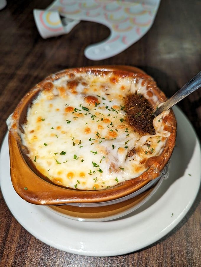 French onion soup with a cheese pull that deserves its own Olympic event. Bubbling, golden, and soul-warming in every spoonful.