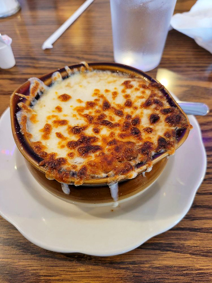 French onion soup with a cheese cap so perfectly browned it deserves its own Instagram account. Spoon-breaking satisfaction guaranteed.