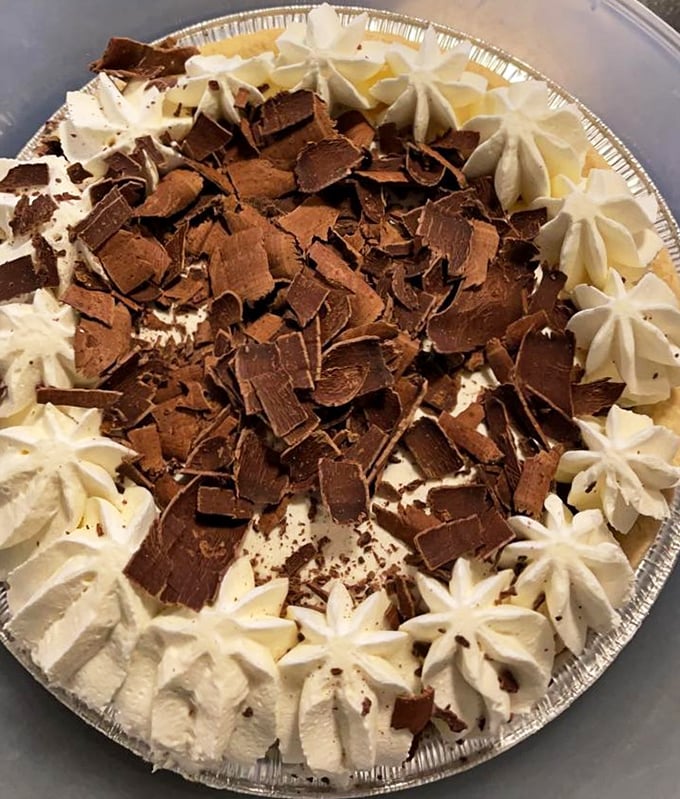 A French silk pie that would make Julia Child swoon. Those chocolate curls aren't just decoration; they're a promise of the richness waiting beneath.