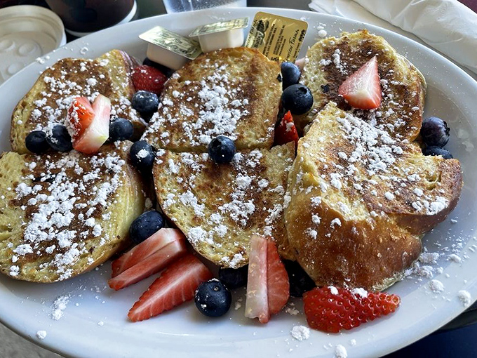 French toast that's dressed for success with powdered sugar snow and a berry entourage&mdash;proof that mornings can indeed be something to look forward to.