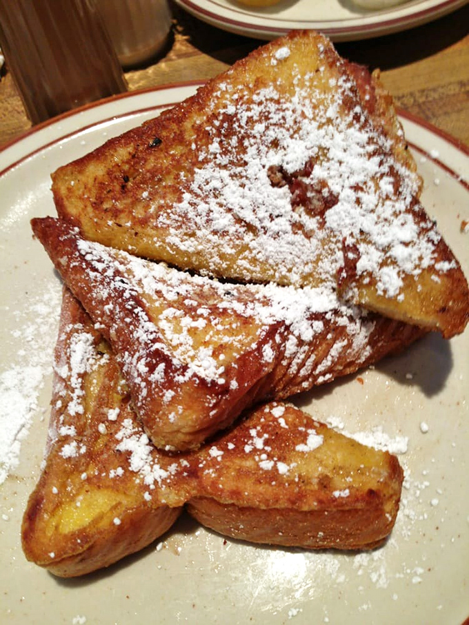 French toast that's crossed the line from breakfast to dessert, dusted with powdered sugar like a fresh California snowfall.