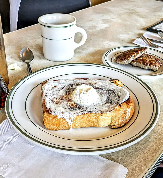 French toast that makes you understand why people write love songs. That melting butter is performing a slow dance that deserves a standing ovation.