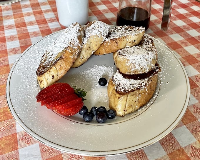 French toast that's been properly introduced to powdered sugar and fresh berries&mdash;a breakfast triple threat.