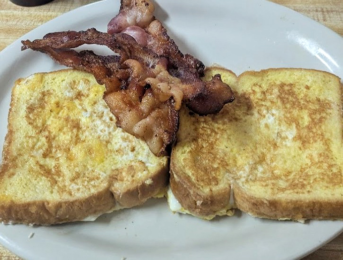 Breakfast that understands its purpose in life isn't to be photographed but to fuel your day with golden French toast and bacon cooked exactly right.