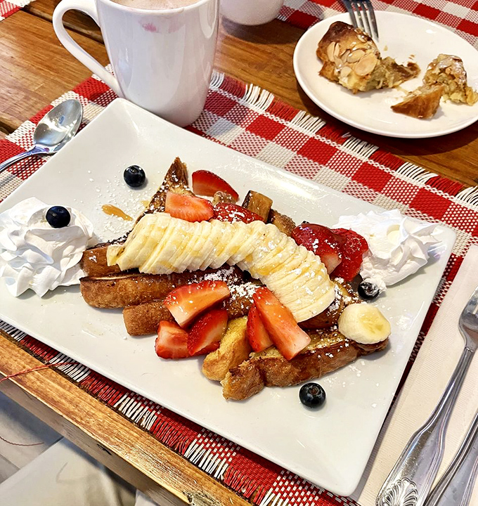 French toast that transforms humble bread into a canvas for fresh fruit and maple syrup. Breakfast or dessert? The line deliciously blurs.