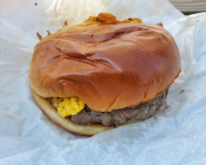 Yes, that's fried bacon and egg atop a cheeseburger, because sometimes restraint is overrated and delicious.