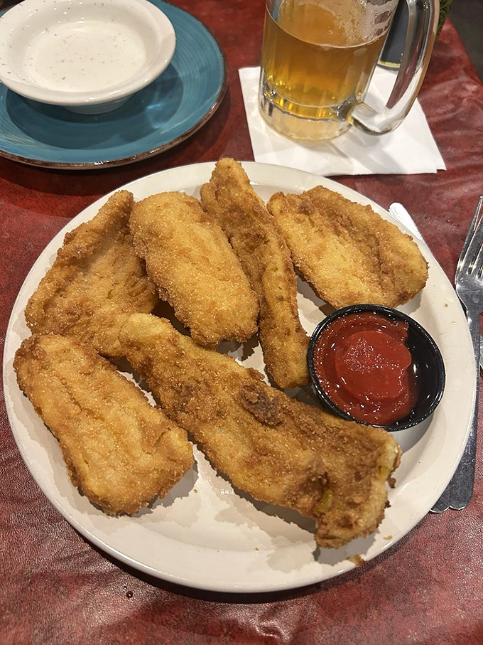 Golden-fried catfish that crackles with each bite, served alongside a dipping sauce that adds just the right amount of zing to this Southern classic.