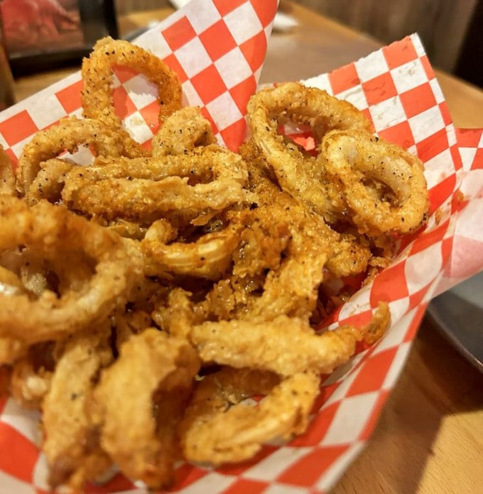 Crispy calamari rings stacked like delicious little life preservers. Dive in without fear of getting wet.