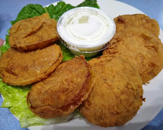 Fried green tomatoes: the South's gift to the culinary world. Crispy outside, tangy inside—a perfect opening act to the seafood main event.