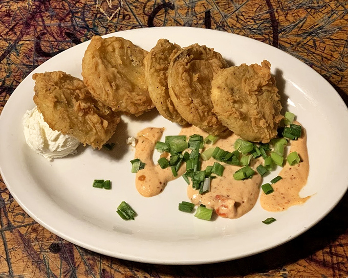 Fried green tomatoes so perfectly golden and crispy, they make you understand why someone wrote a whole movie about them.