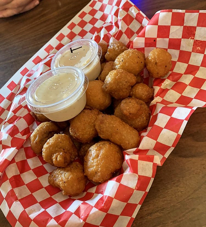 Fried mushrooms: nature's way of saying "vegetables can be fun too." These golden orbs disappear faster than your New Year's resolutions.