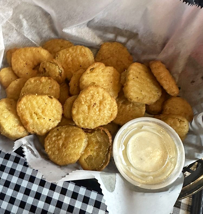 Golden-fried pickle chips: the South's contribution to snack perfection. Crispy, tangy discs of joy that disappear faster than Georgia summer rain.