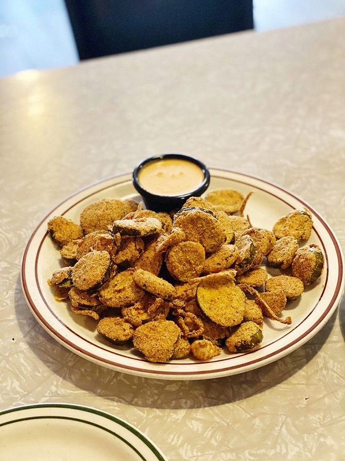 Fried okra that could convert even the most stubborn vegetable skeptics, served with a dipping sauce worth bottling.
