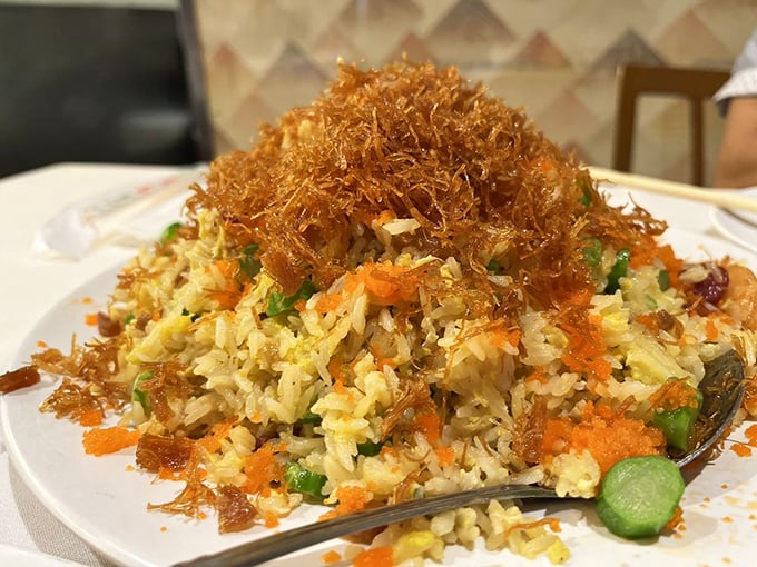 This isn't just fried rice&mdash;it's a masterclass in texture with crispy wisps crowning fluffy grains studded with colorful vegetables. Forget being a side dish; this demands center stage.
