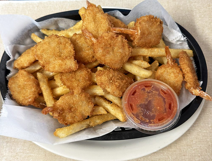 Golden-fried shrimp that snap between your teeth, served with fries and a dipping sauce that demands to be part of the conversation.