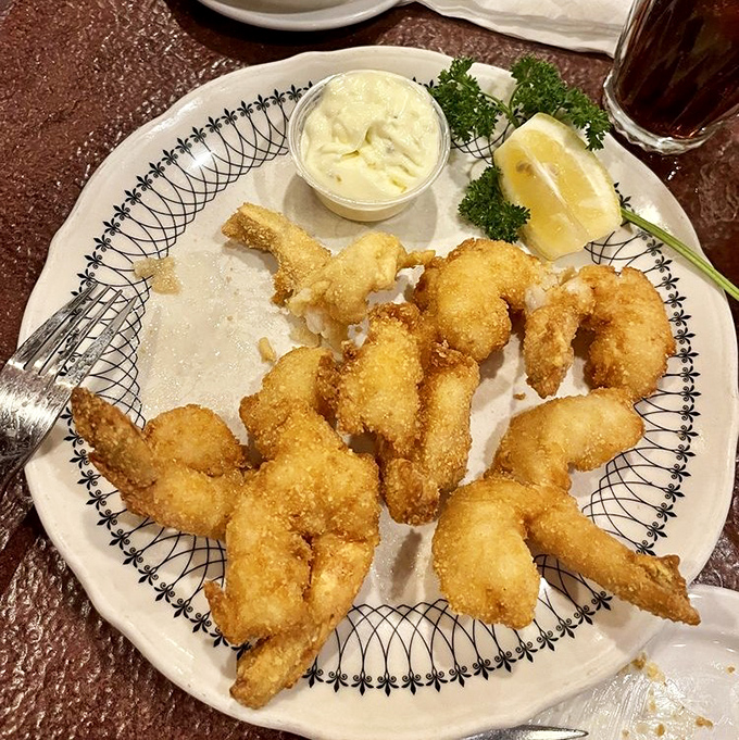 These golden-battered shrimp are the reason napkins were invented. Crispy, light, and impossible to stop eating once you start.