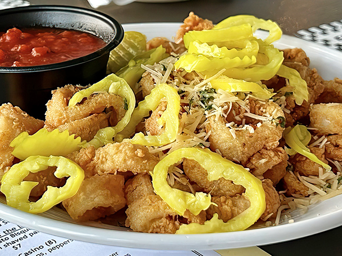 Fried calamari with banana peppers&mdash;proof that sometimes the best things in life come in golden rings with a side of marinara.