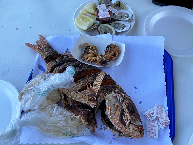This whole fried fish stares back as if to say, "Worth it"&mdash;crispy on the outside, flaky and moist within, served with the simplicity that only confidence allows.