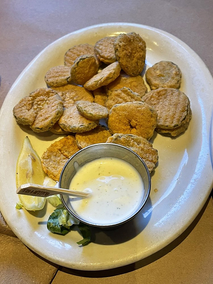These fried pickles with their creamy dipping sauce prove that sometimes the humble cucumber's highest calling is to be brined, battered, and fried to perfection.