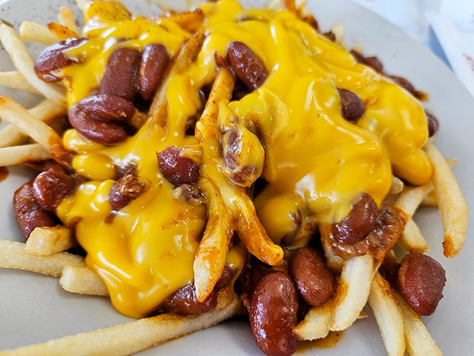 Cheese fries that make sharing impossible. "I'll just have one" becomes the biggest lie you'll tell yourself today.