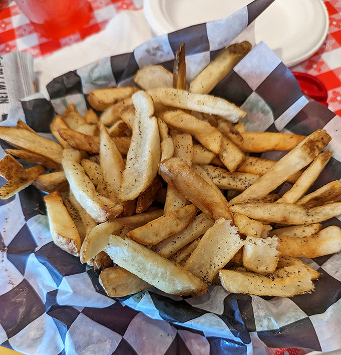 These seasoned fries understand their supporting role perfectly &ndash; crispy, flavorful sidekicks to the main seafood show above.