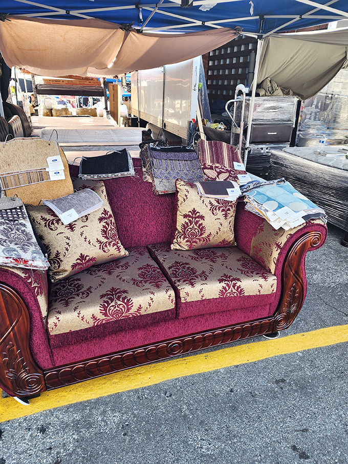 A royal throne for commoner prices. This burgundy damask sofa would look right at home in a palace—or your living room.